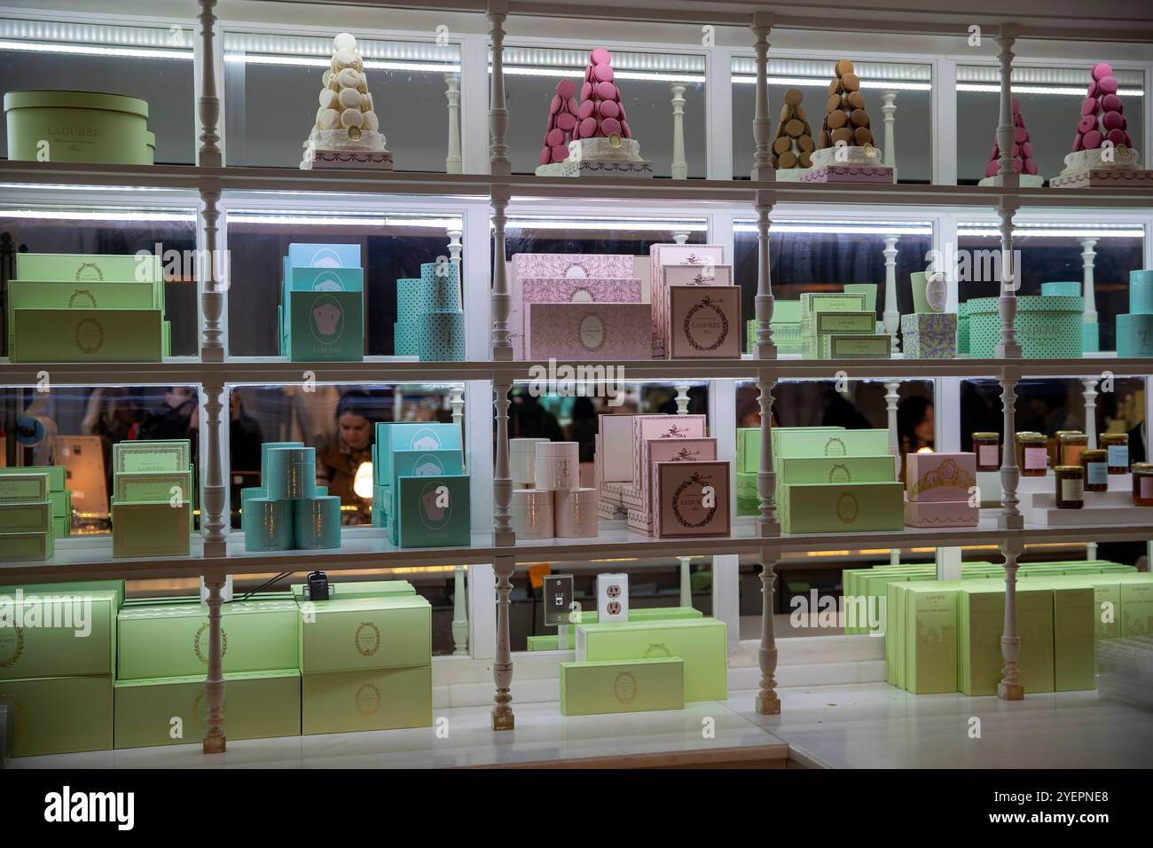 This photograph shows the interior of a Ladurée shop, with shelves ...