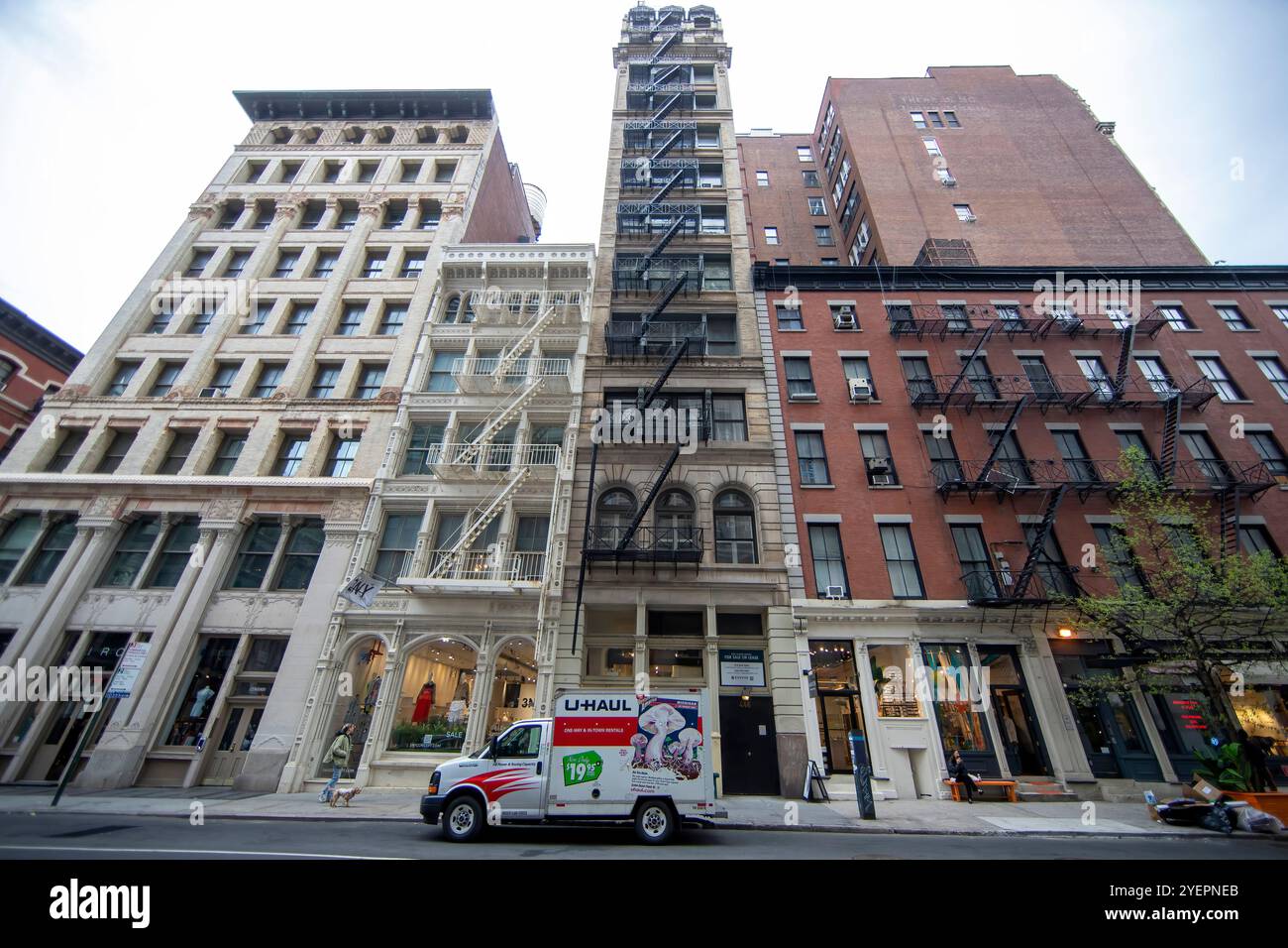 This photograph captures a row of classic New York City buildings with ...