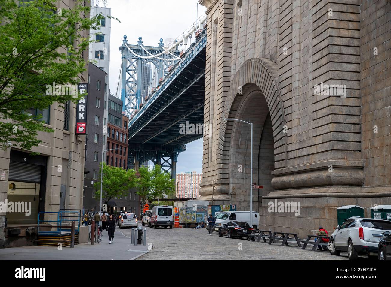 This photo captures a street view in DUMBO, Brooklyn, with the massive ...