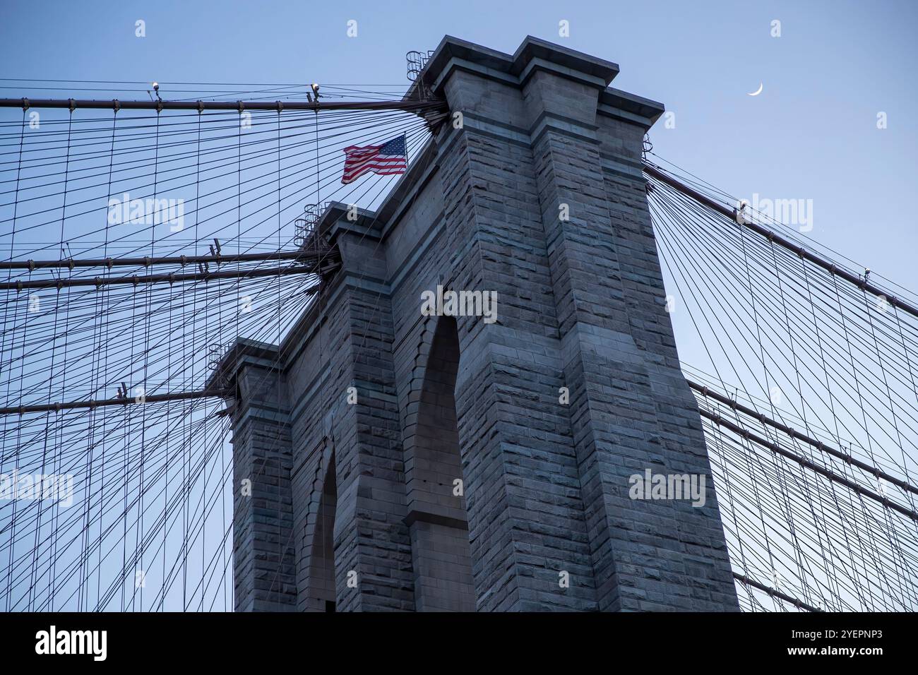 Close-up photograph of the Brooklyn Bridge tower, highlighting its ...