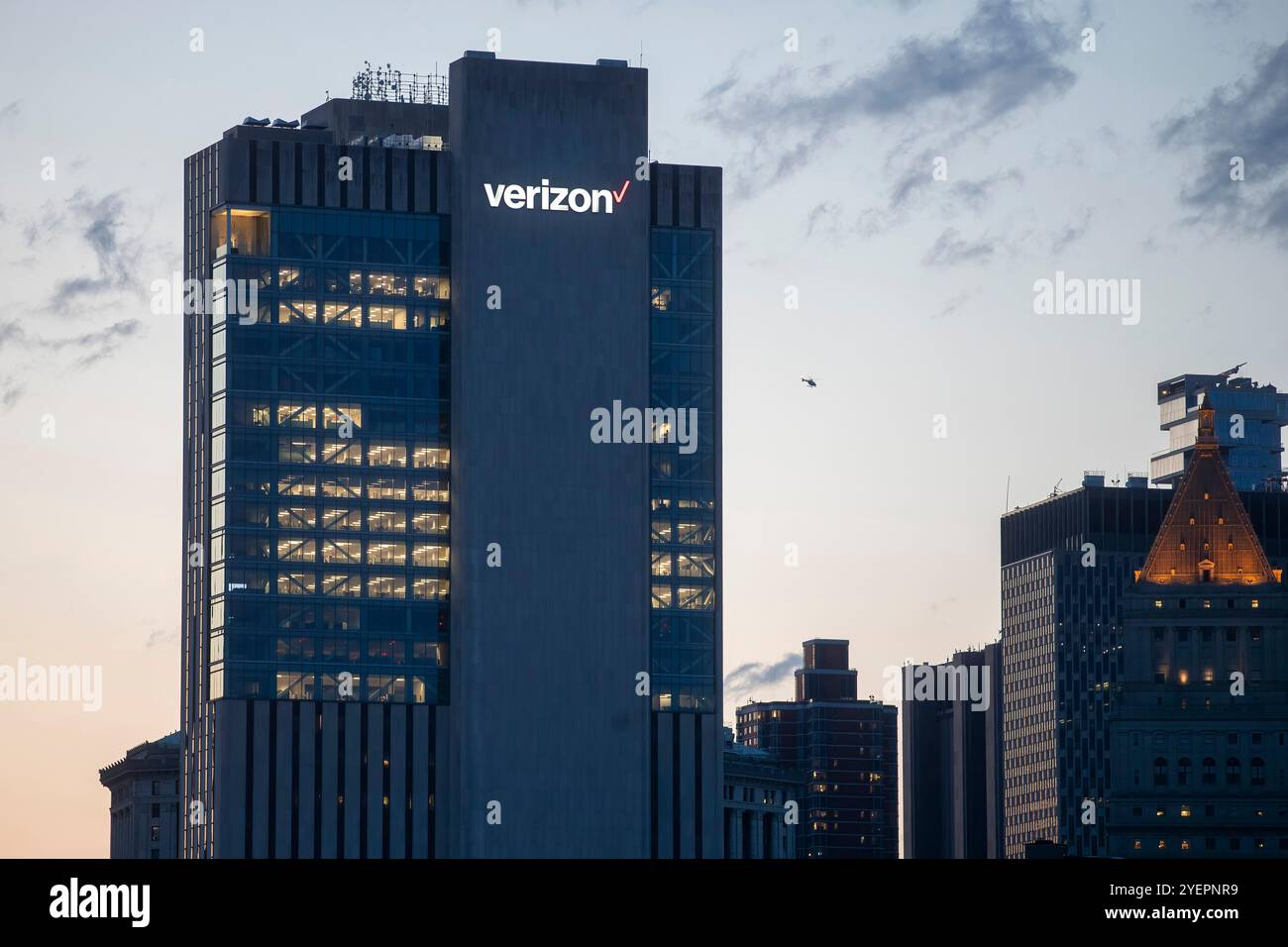 The illuminated windows and the "Verizon" logo stand out on the ...