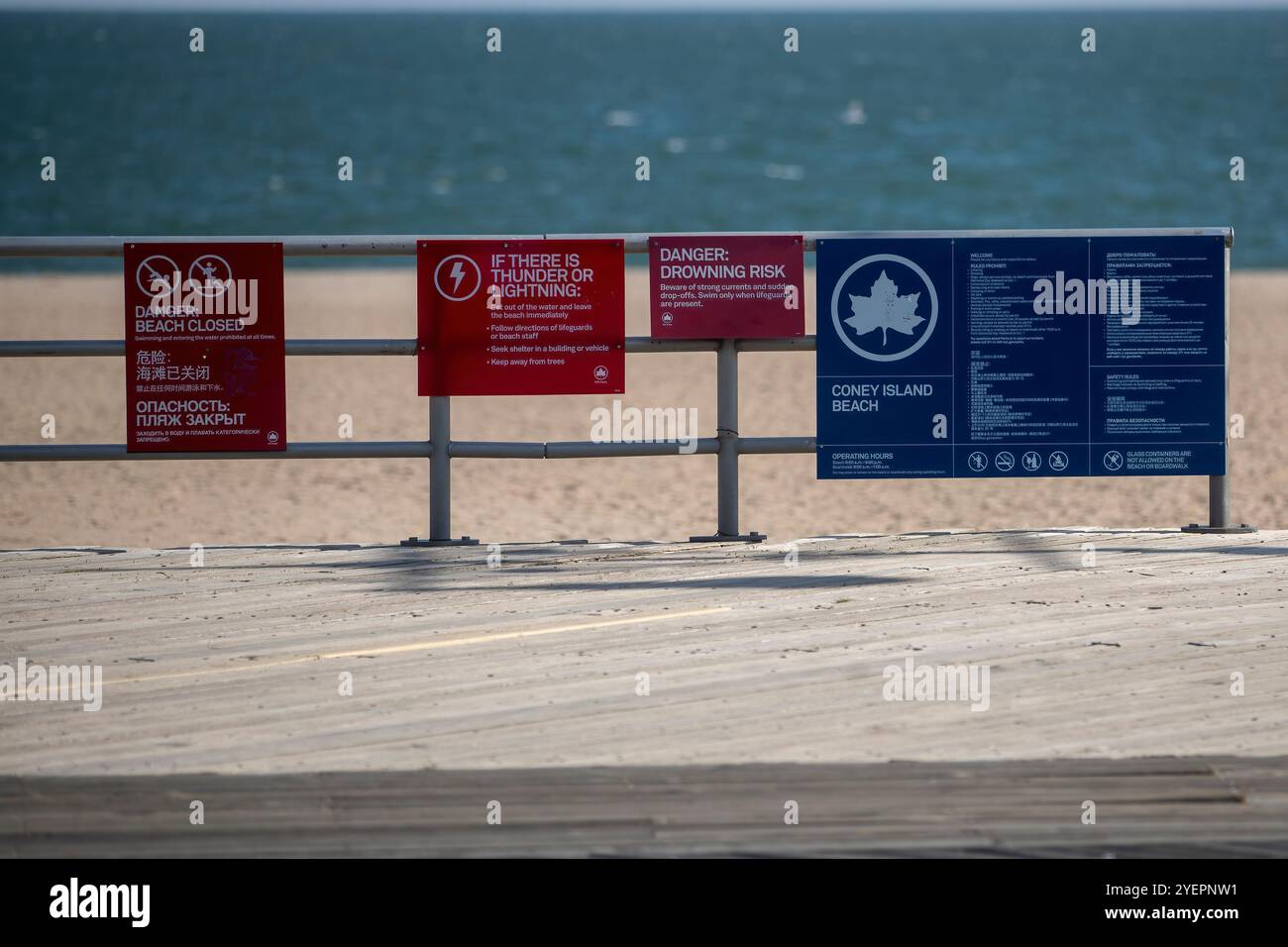 This image captures a set of warning signs along the Coney Island ...