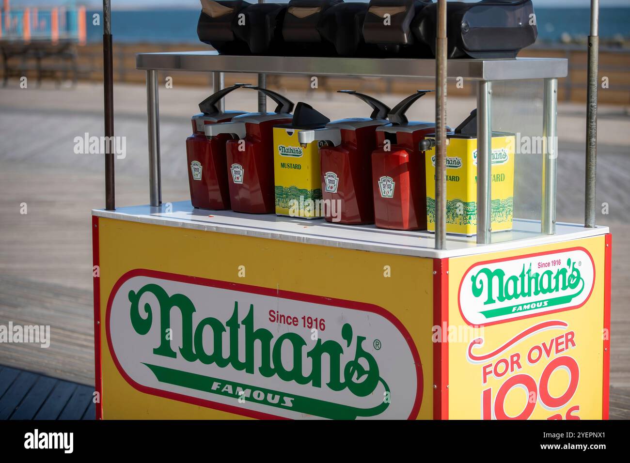 This image captures a condiment station from Nathan's Famous, featuring ...