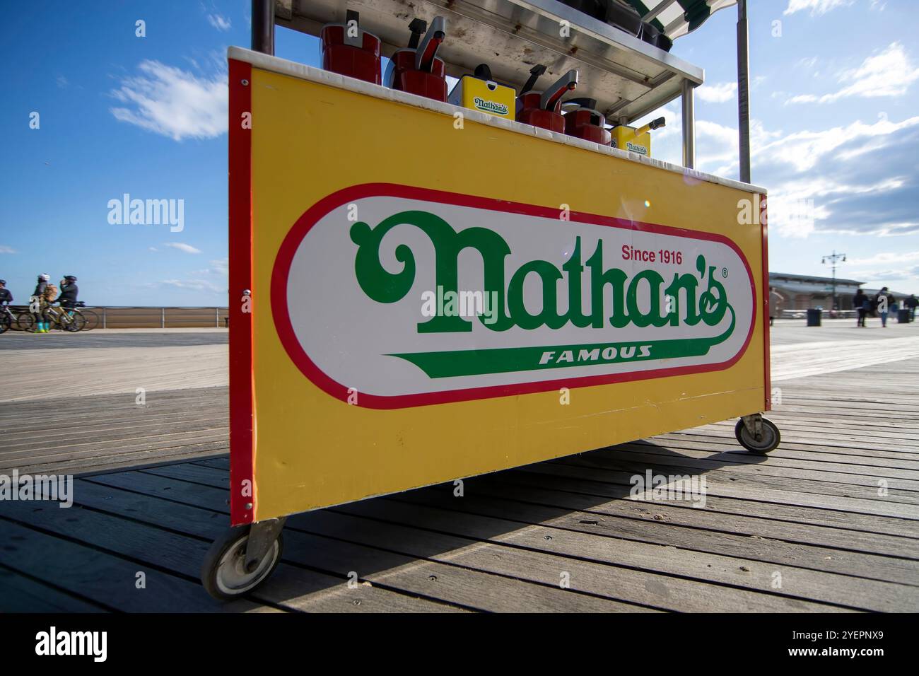 This image captures a condiment station from Nathan's Famous, featuring ...