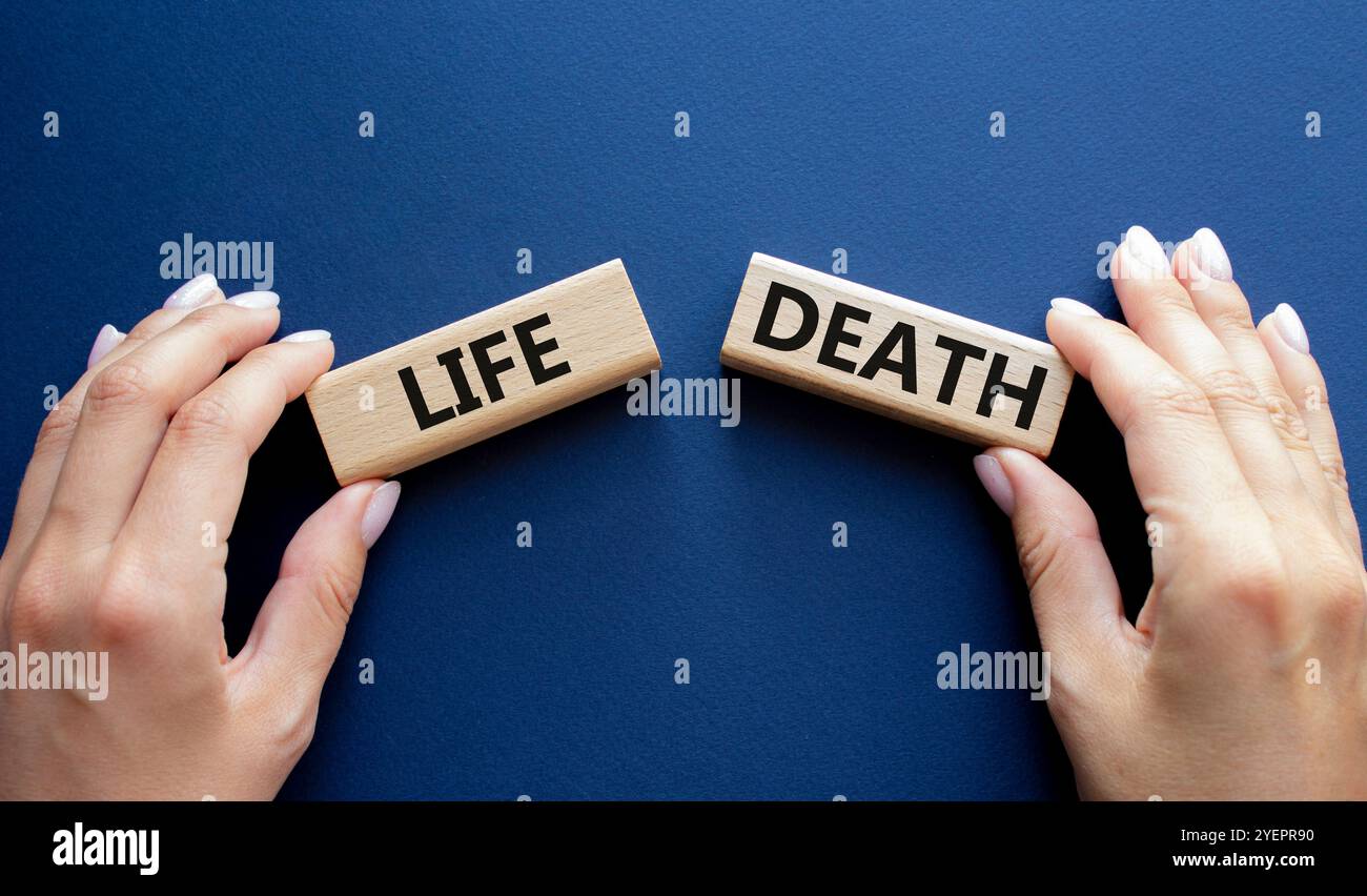 Life or Death symbol. Concept word Life or Death on wooden blocks ...