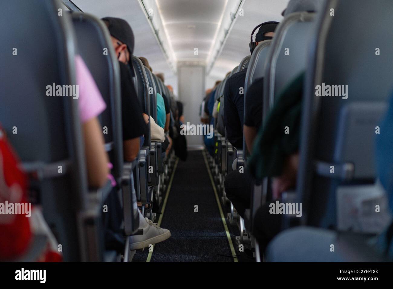 People passengers sit in seats during a flight on an airplane Stock ...