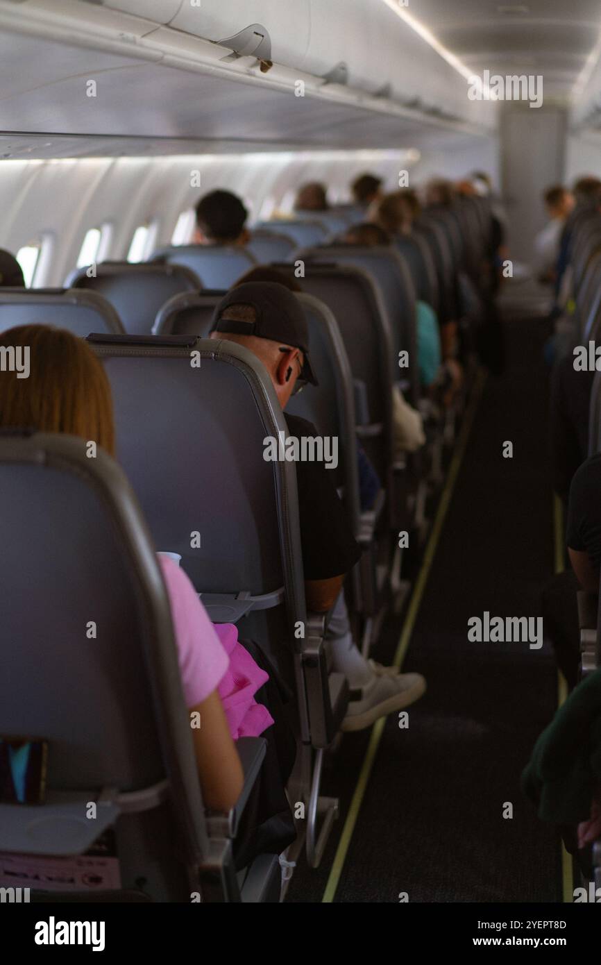 Flight attendant on airplane hi-res stock photography and images - Alamy