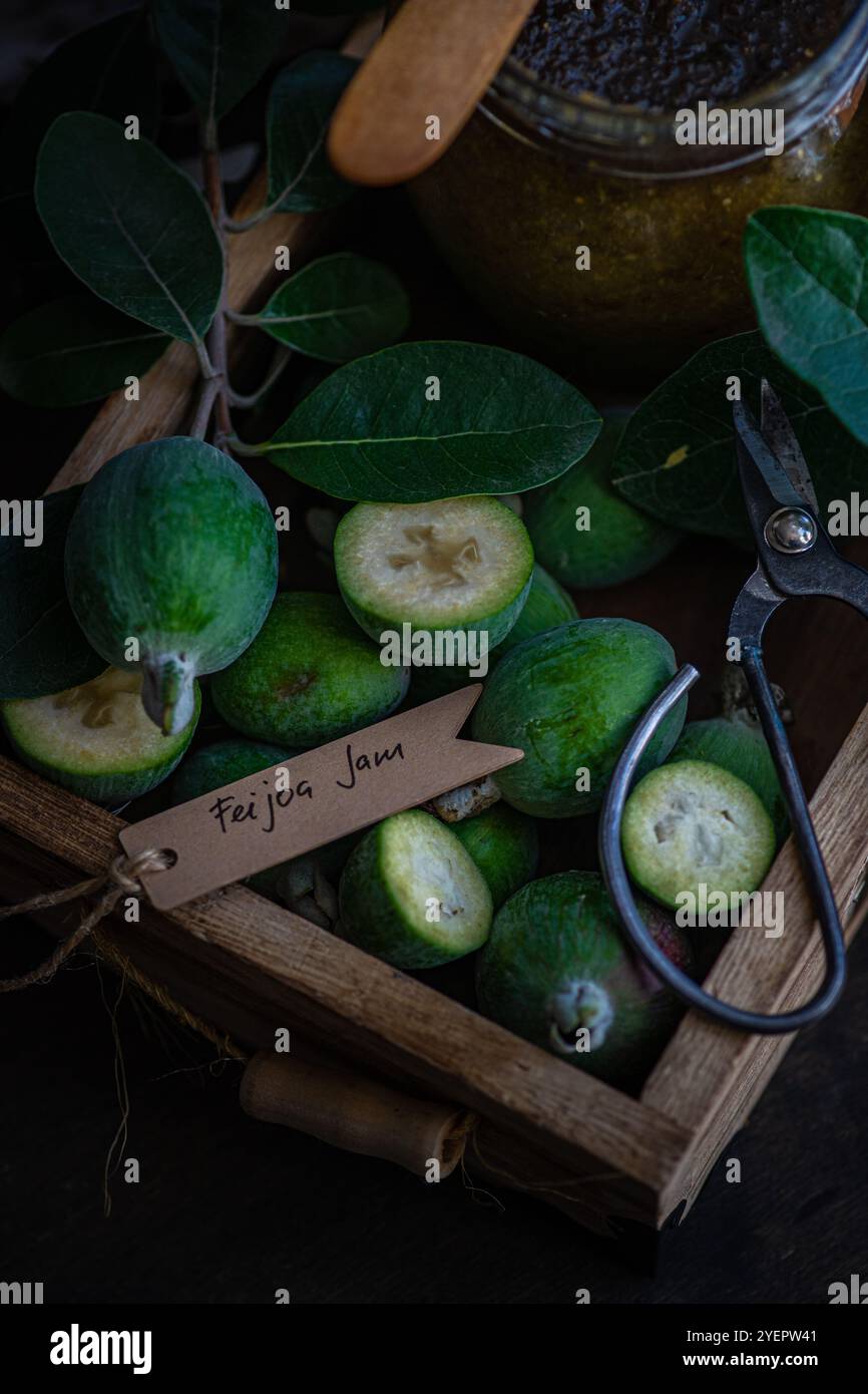 Wooden box with the jar of feijoa jam Stock Photo - Alamy