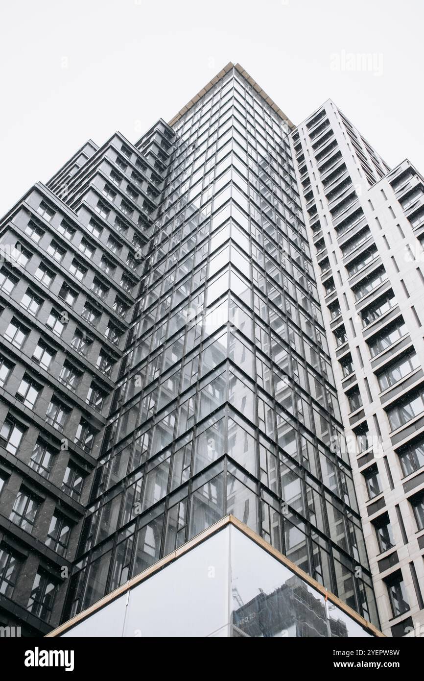 a tall new skyscraper with large windows Stock Photo - Alamy
