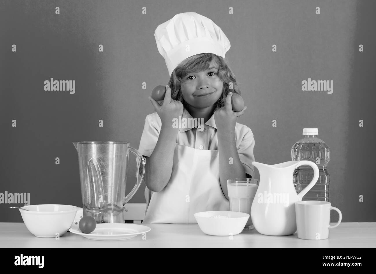 Child chef isolated on blue. Funny little kid chef cook wearing uniform ...