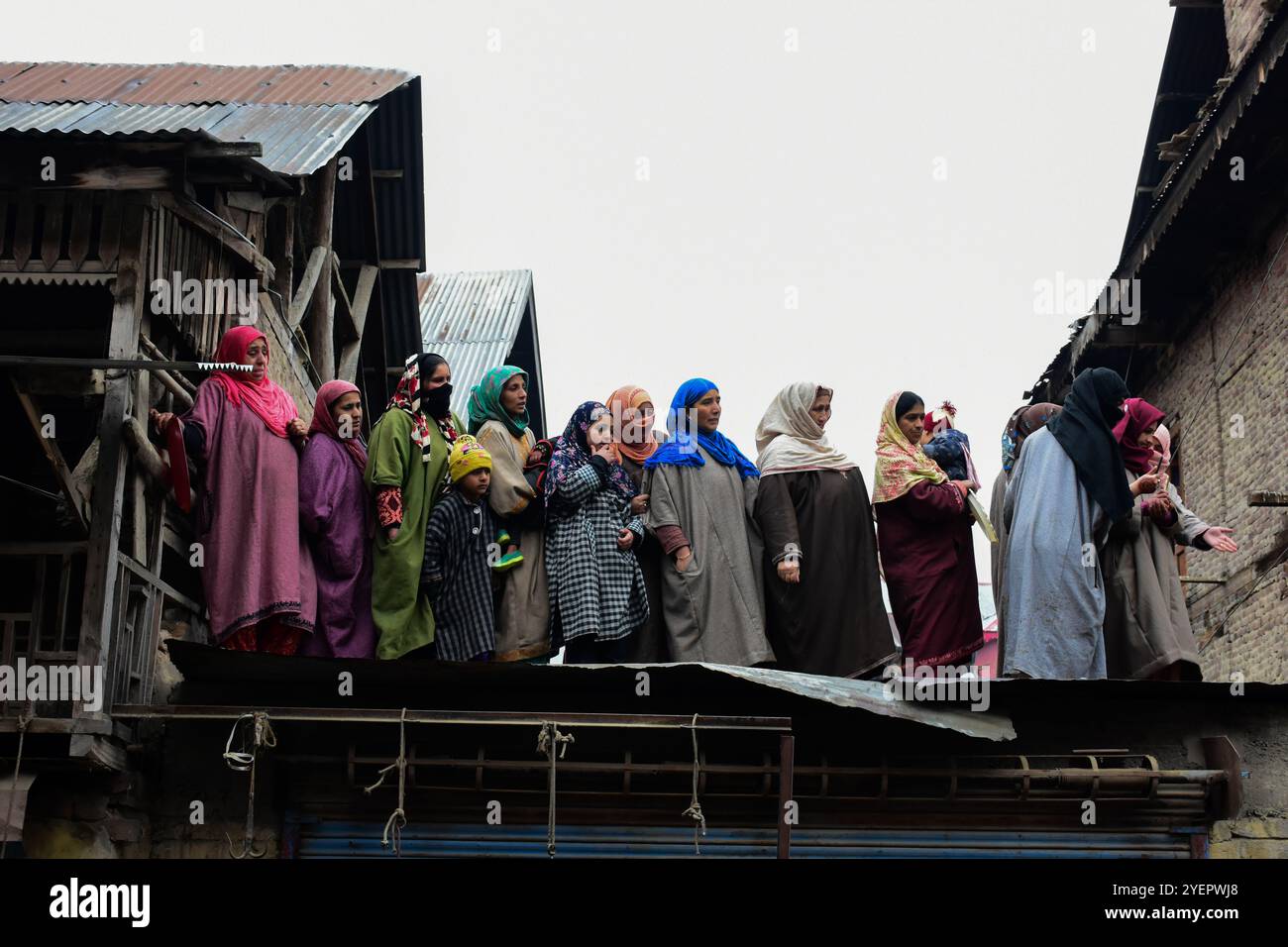 Thousands of mourners carry the body of alleged rebels Mudasir Parray, 14, and Mudasir Parray ...