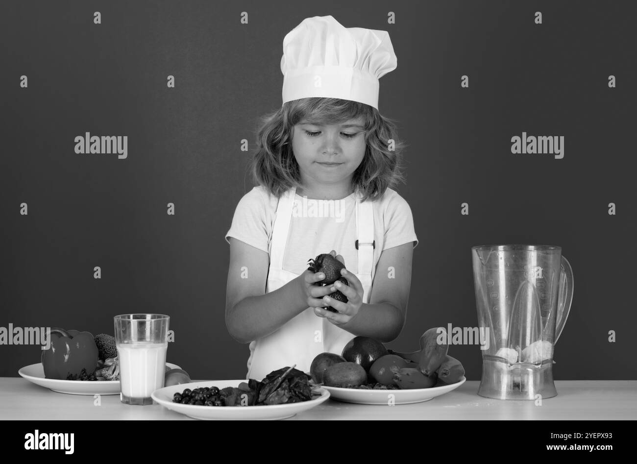 Portrait of chef child in cook hat. Cooking at home, kid boy preparing ...