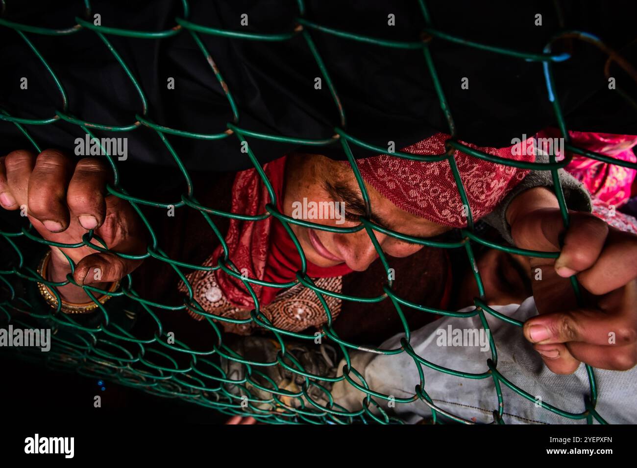 Thousands of mourners carry the body of alleged rebels Mudasir Parray, 14, and Mudasir Parray ...