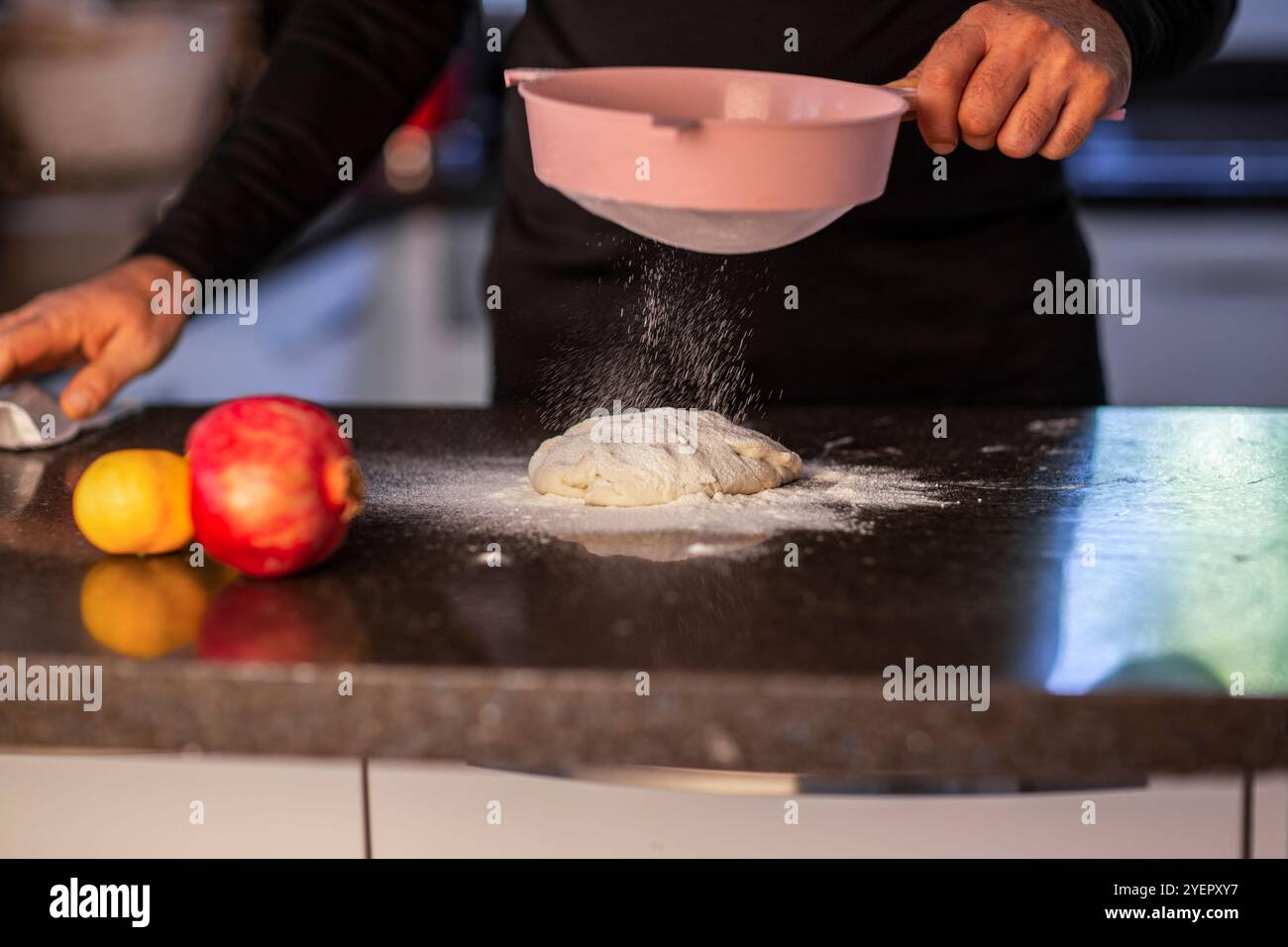 Man's hands sifting flour on dough through a sieve Stock Photo - Alamy