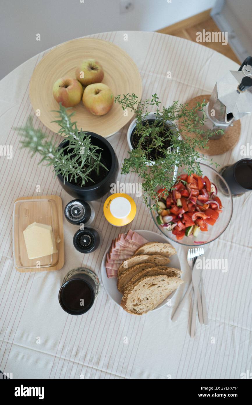 Breakfast Spread with Salad, Bread, Apples, and Fresh Herbs Stock Photo ...