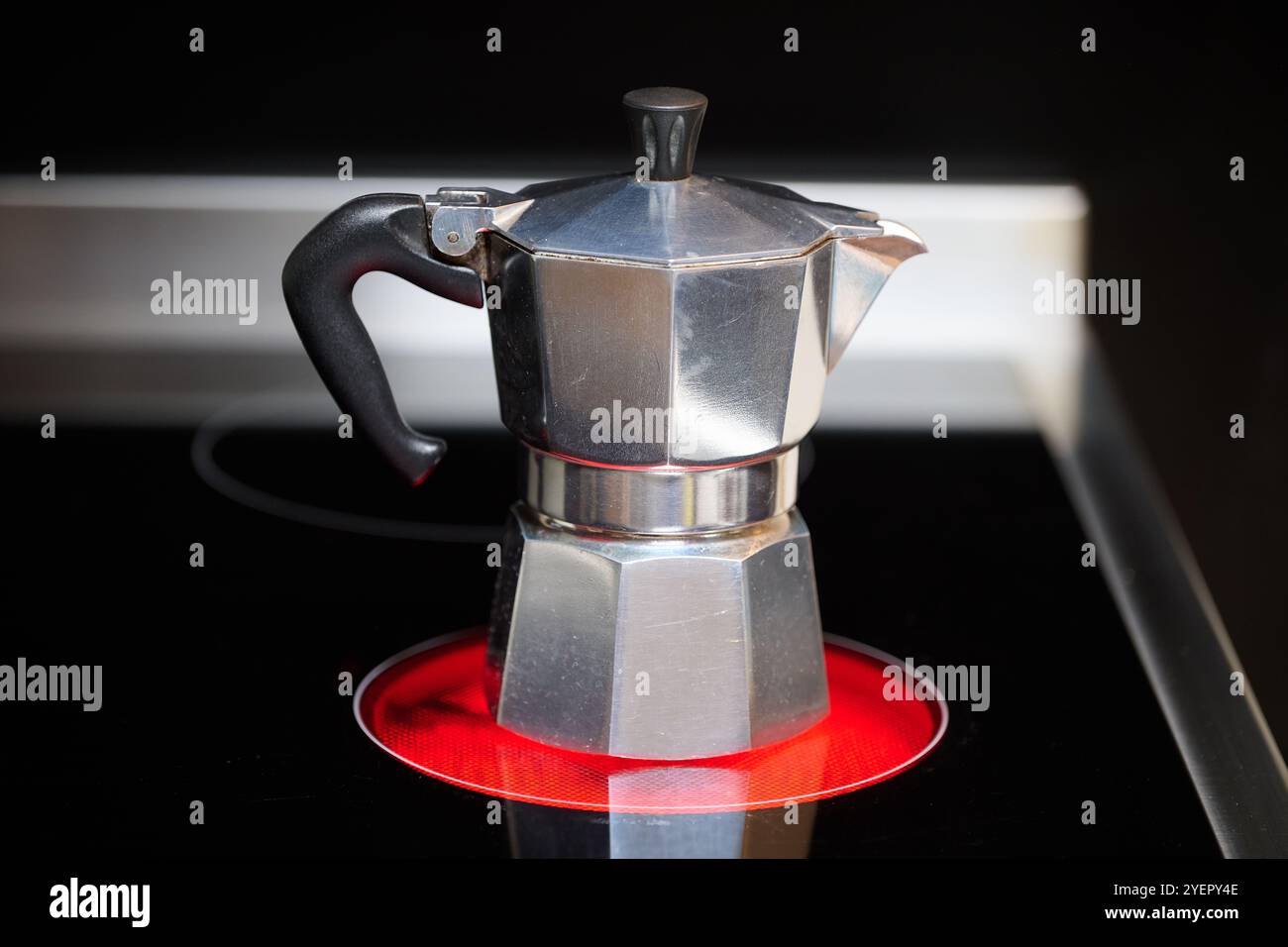 Prepare and serve coffee with an Italian coffee maker Stock Photo - Alamy