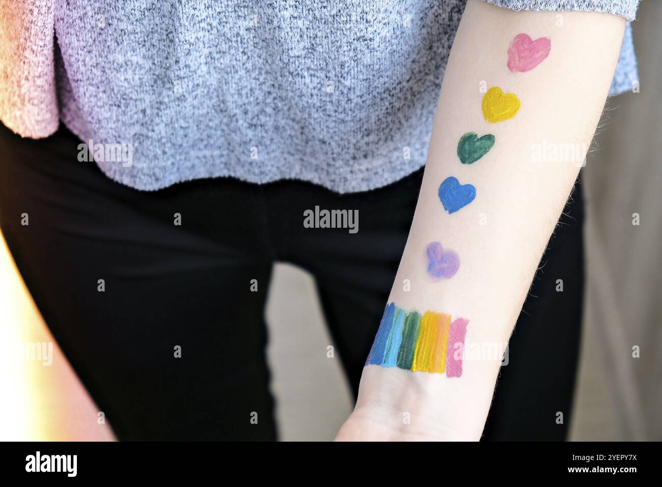 Rainbow LGBTQ flag painted on hand. Support for lgbt community. Honour ...