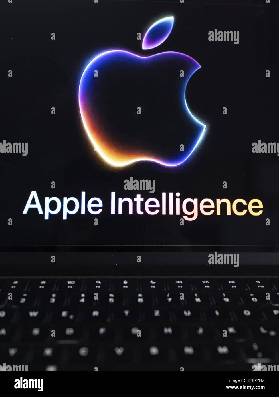 Apple logo in bright neon colours on a Macbook with illuminated ...