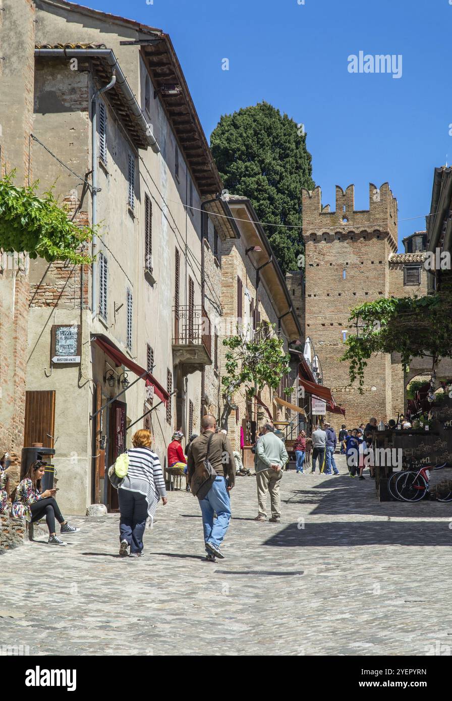 People on the central street in the medieval Gradara Castle, Marche ...