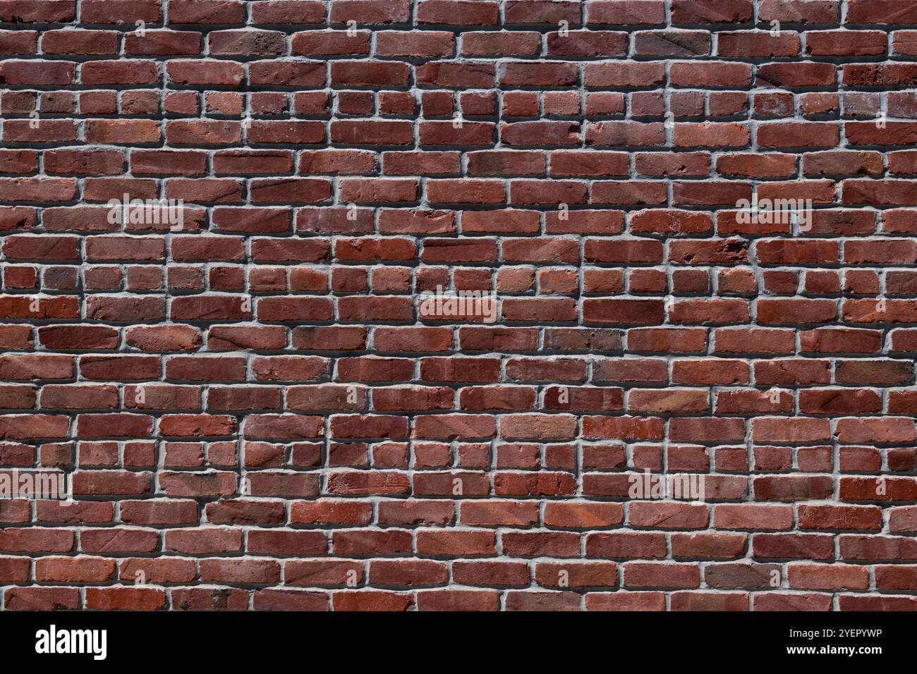 Detail of a section of a red brick wall with rows of clay-fired red ...