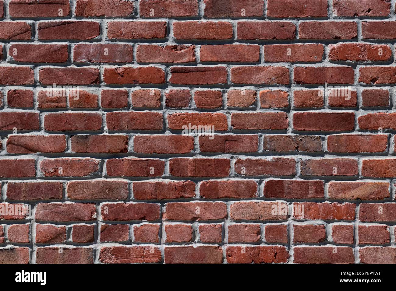 Detail of a section of a red brick wall with rows of clay-fired red ...
