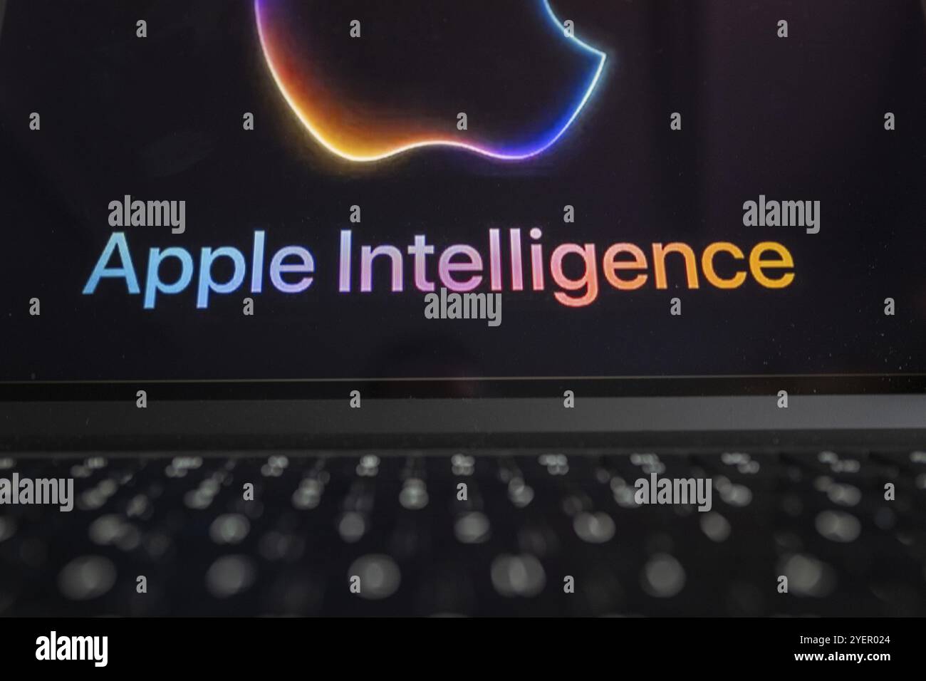 Apple logo in bright neon colours on a Macbook with illuminated ...