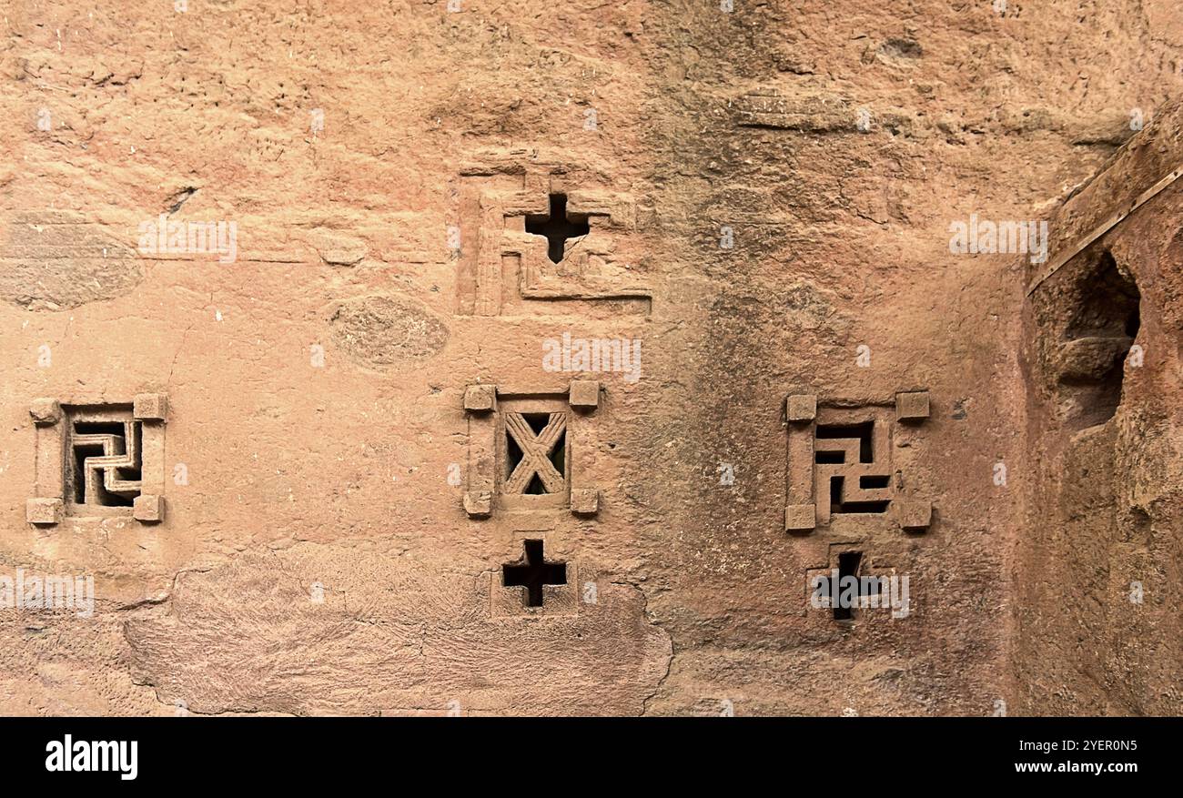Cross-shaped windows carved in stone in the underground monolithic rock ...