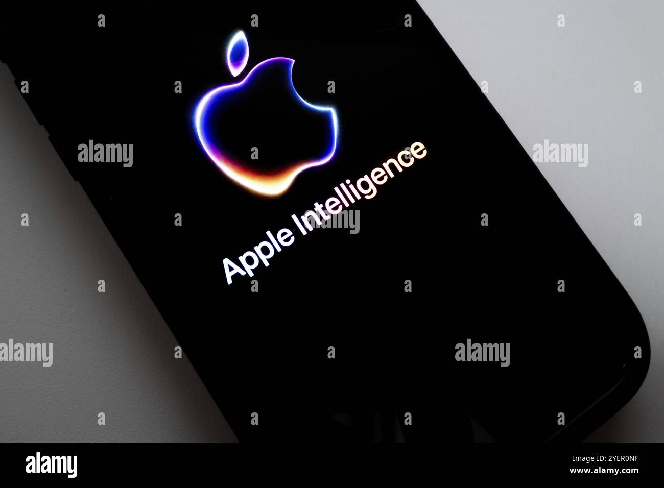 Apple logo on iPhone and the text 'Apple Intelligence', bright and ...