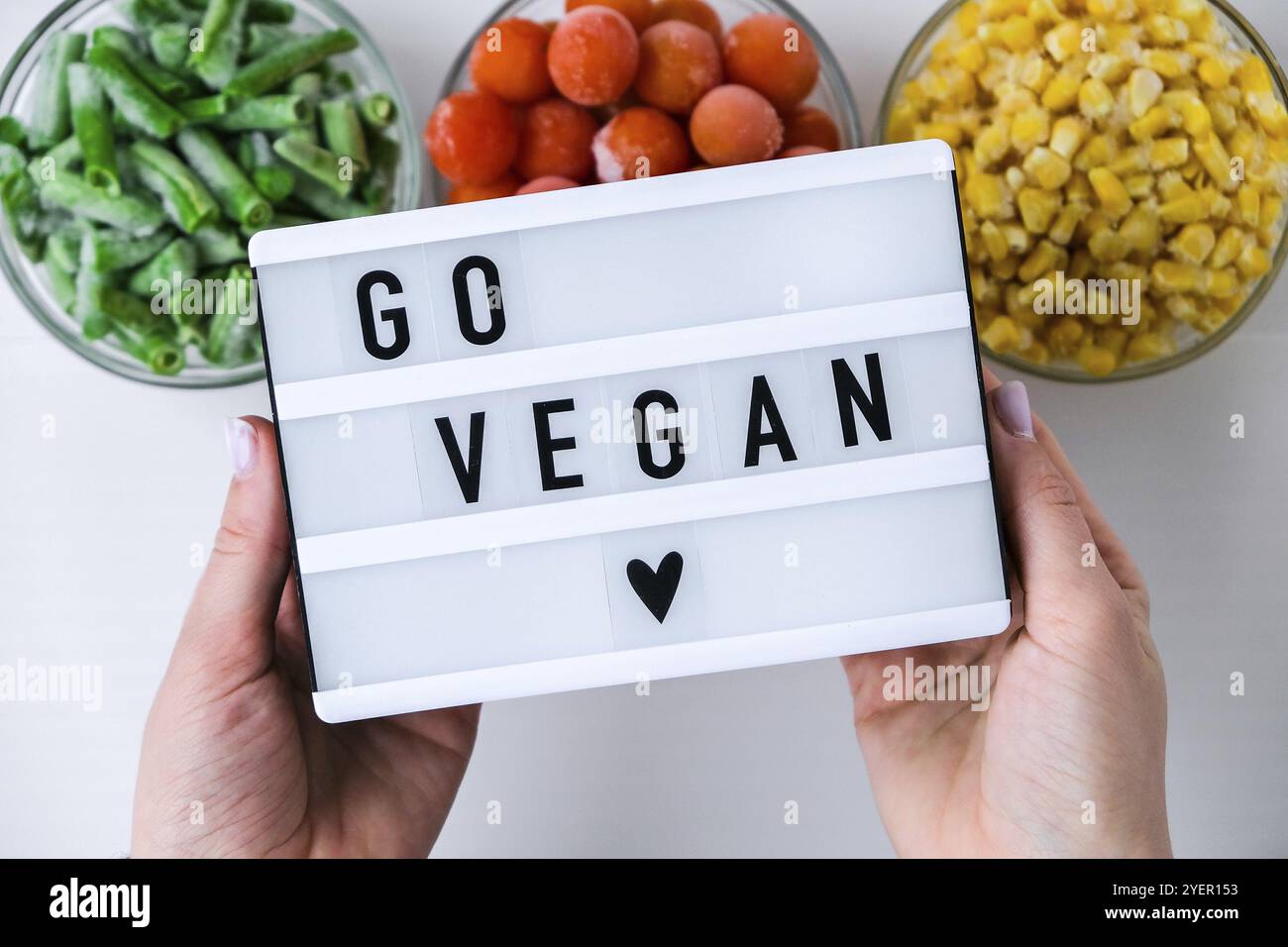 Lightbox with text GO VEGAN Three Bowls of frozen vegetables food of ...