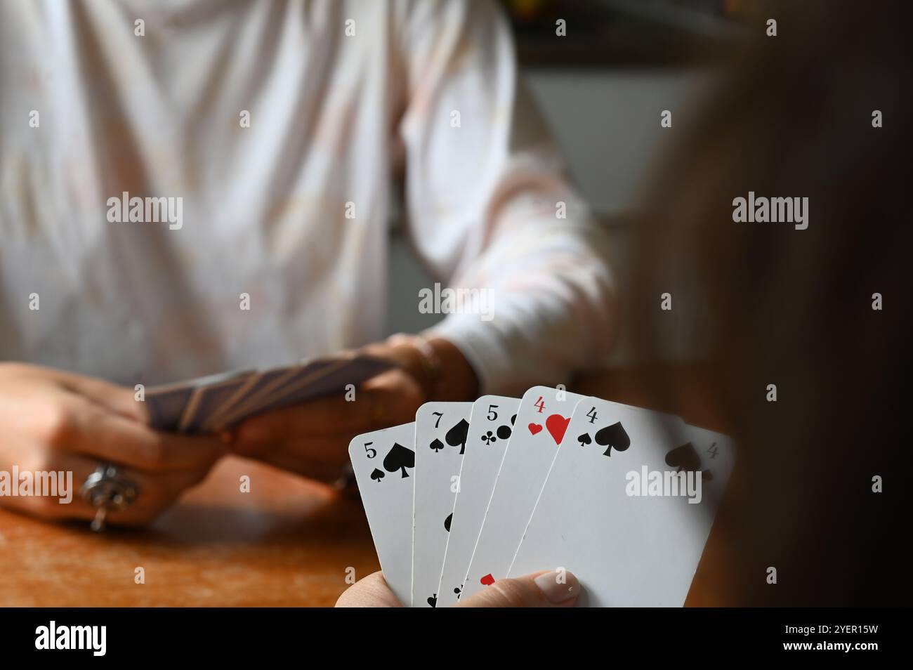 Berlin, Germany. 05th July, 2024. Two people play a card game together ...