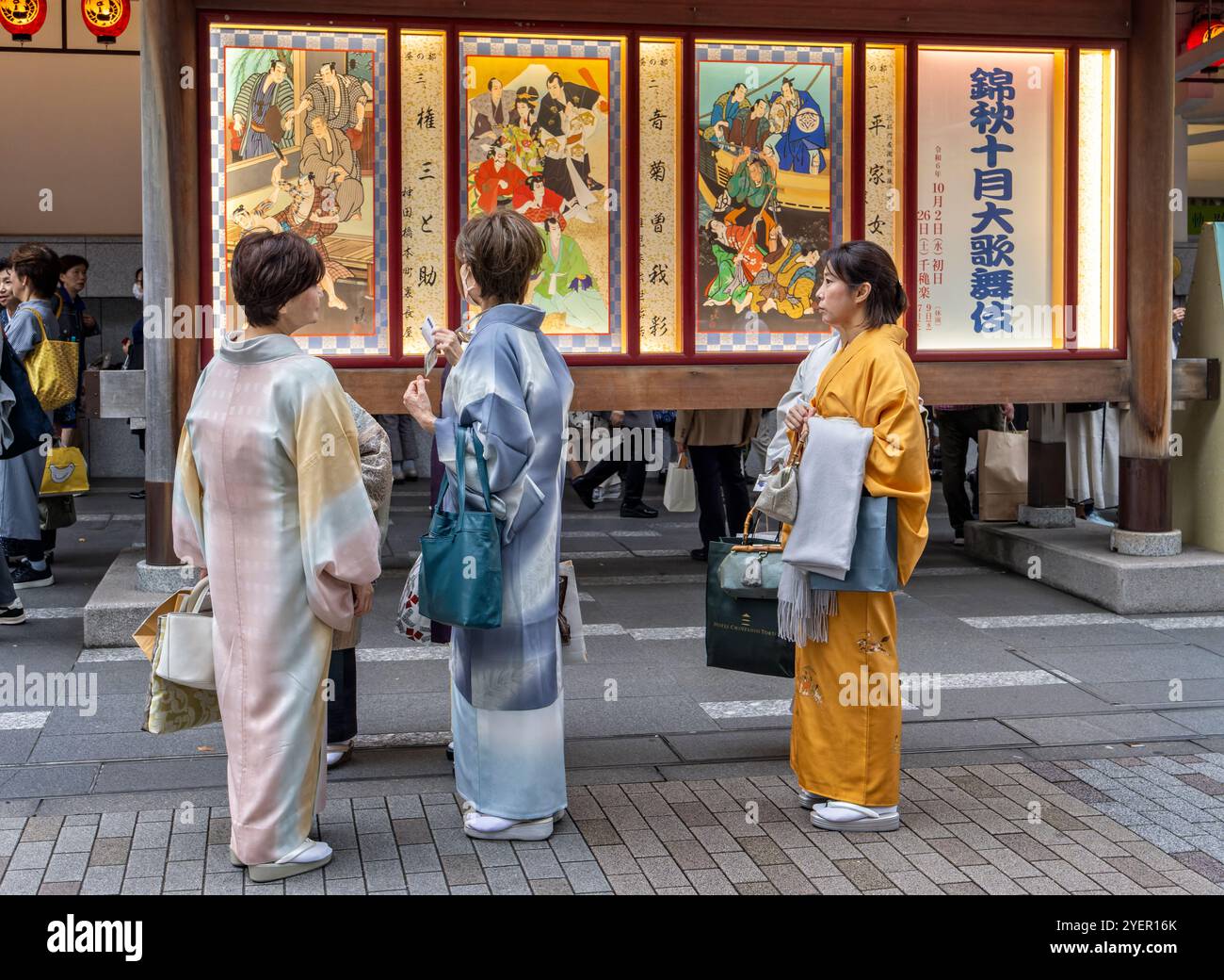 Three ladies in Kimonos outside the Kabukiza Theatre for traditional ...