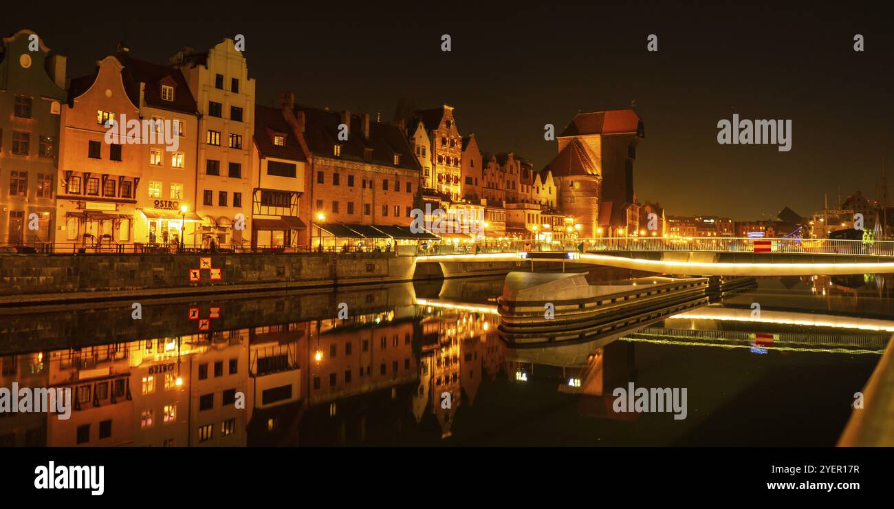 Old town in Gdansk at night. The riverside on Granary Island reflection ...