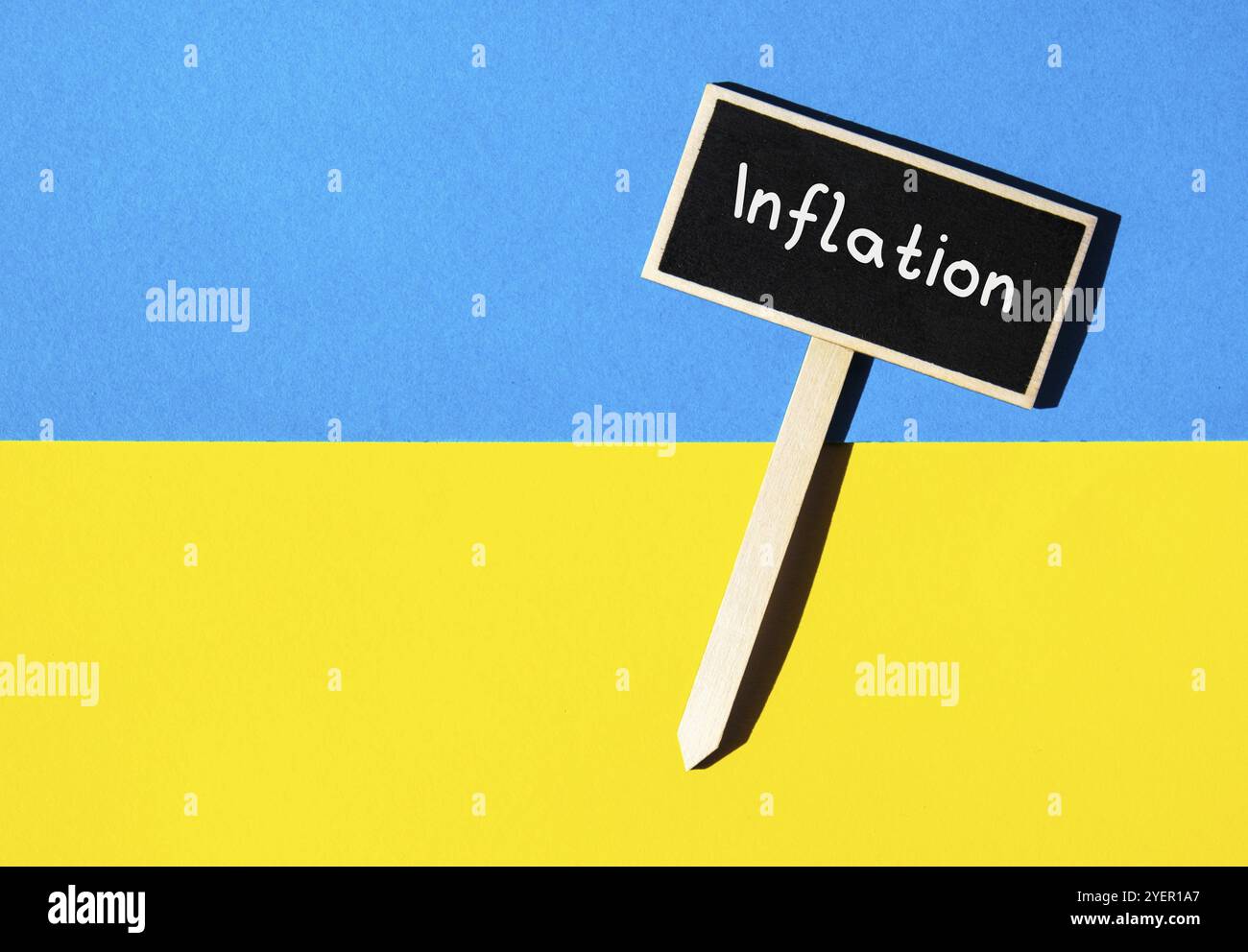 Wooden information label sign with text INFLATION against Ukrainian ...