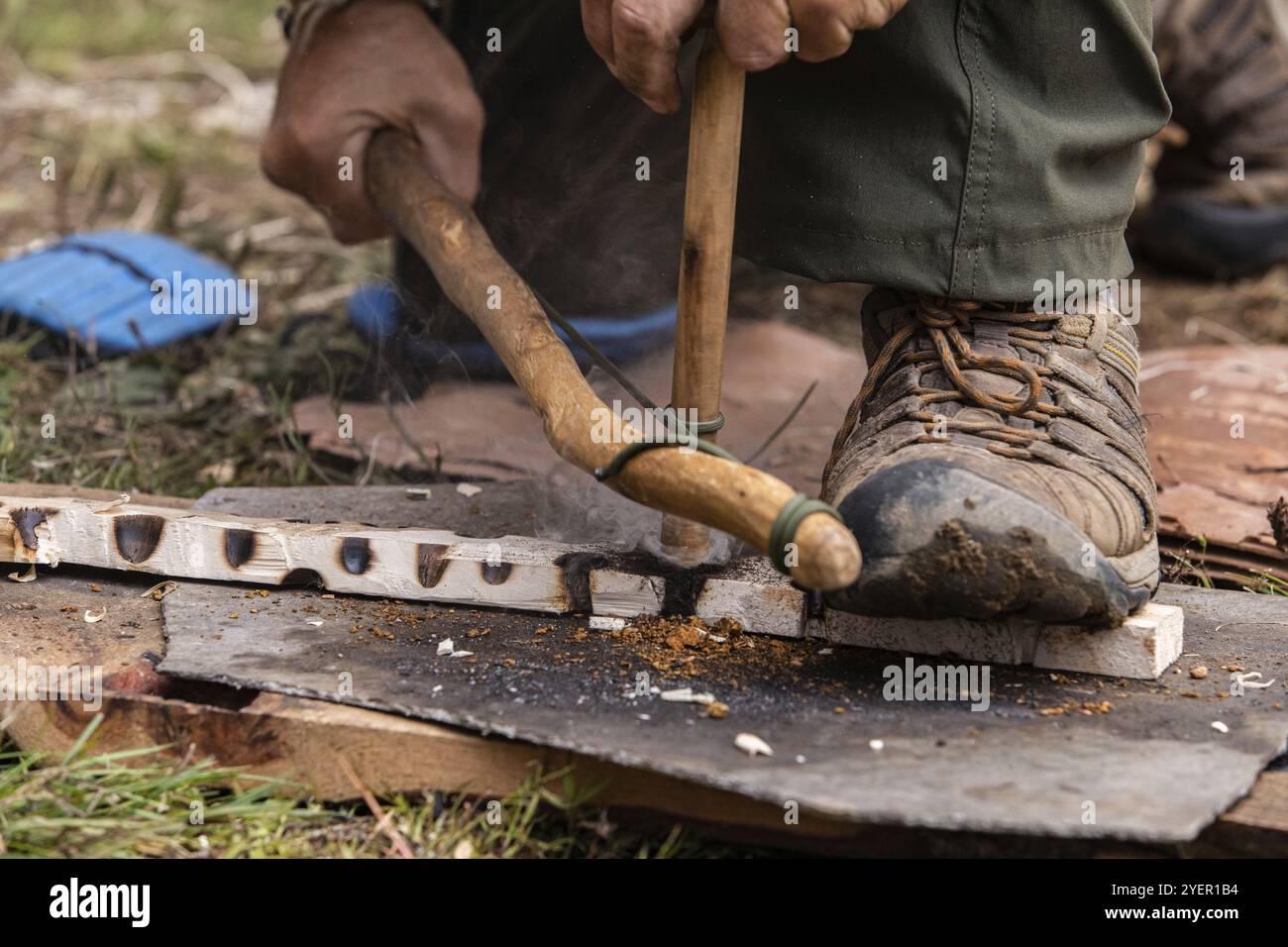 Closeup of man demonstrating a native traditional method for natural ...