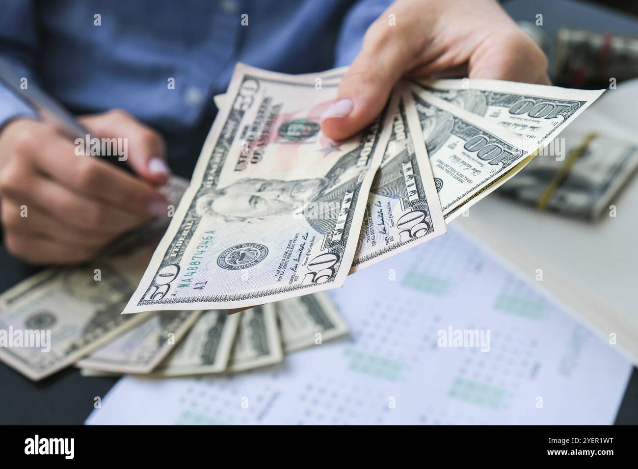 Business Woman Displaying a Spread of Cash US dollars. Close-up. Income ...