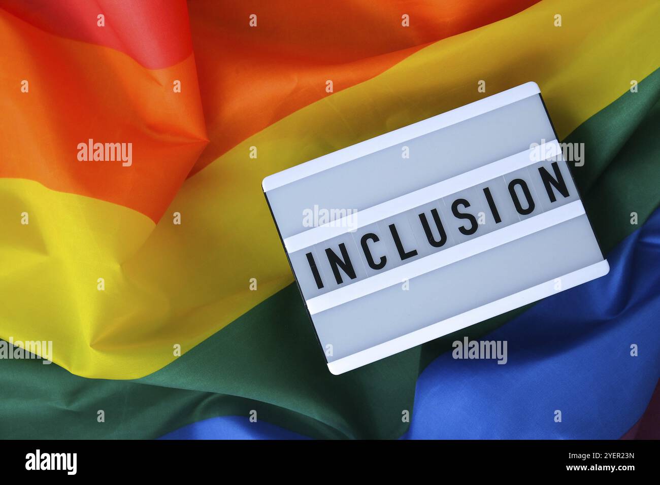 Rainbow flag with lightbox and text INCLUSION. Rainbow lgbtq flag made ...