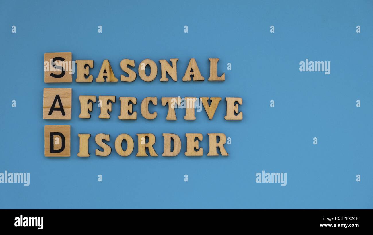 Seasonal affective disorder, text of wooden blocks on blue bright ...