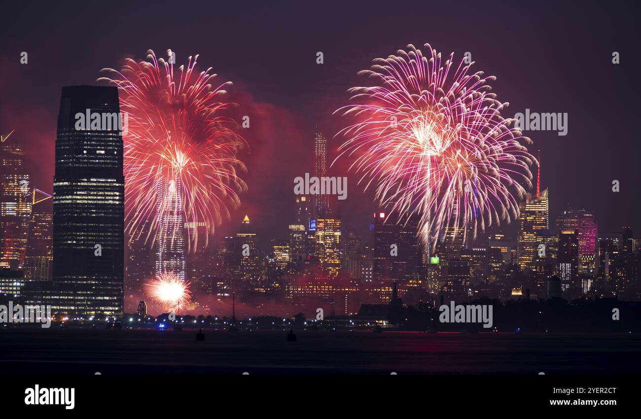 Fireworks are being set off from barges on the river between Jersey ...