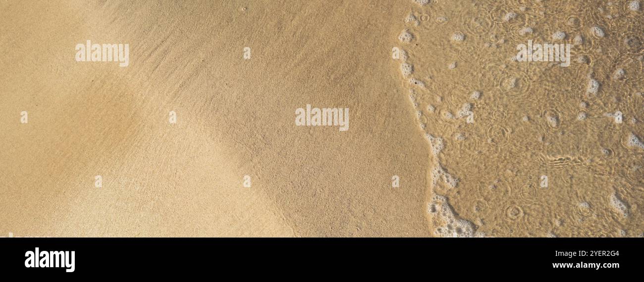 Beach sand background with wave. Copy space for your text advertisement ...