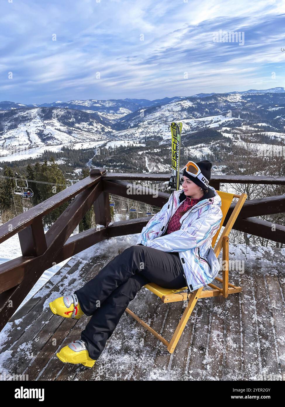 Bukovel Ukraine, February 2022 Skier woman on the ski slope resting ...