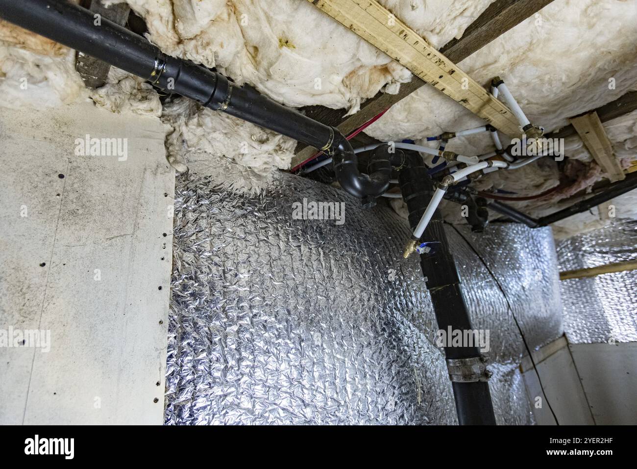 A low angle view on the walls, joists and structural details inside a ...