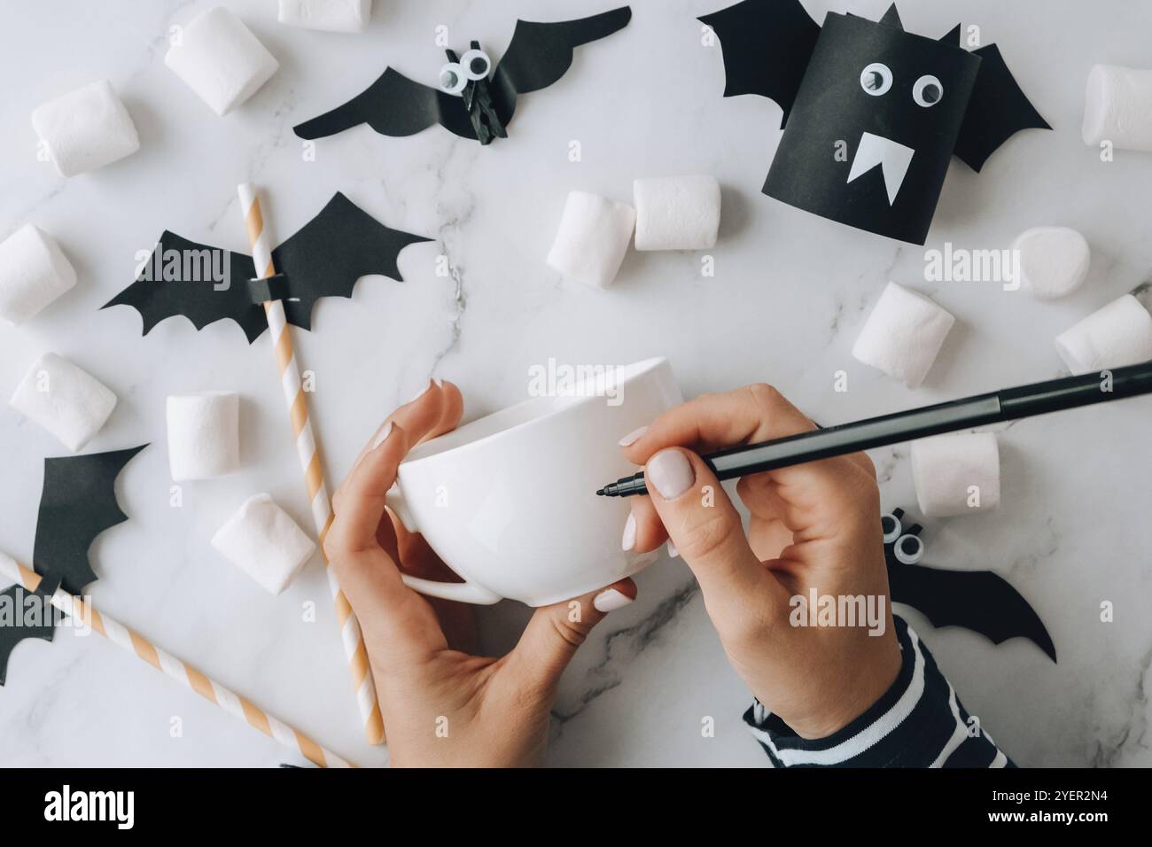 Female hands paint on white cup scary jacks face DIY for kids Halloween ...