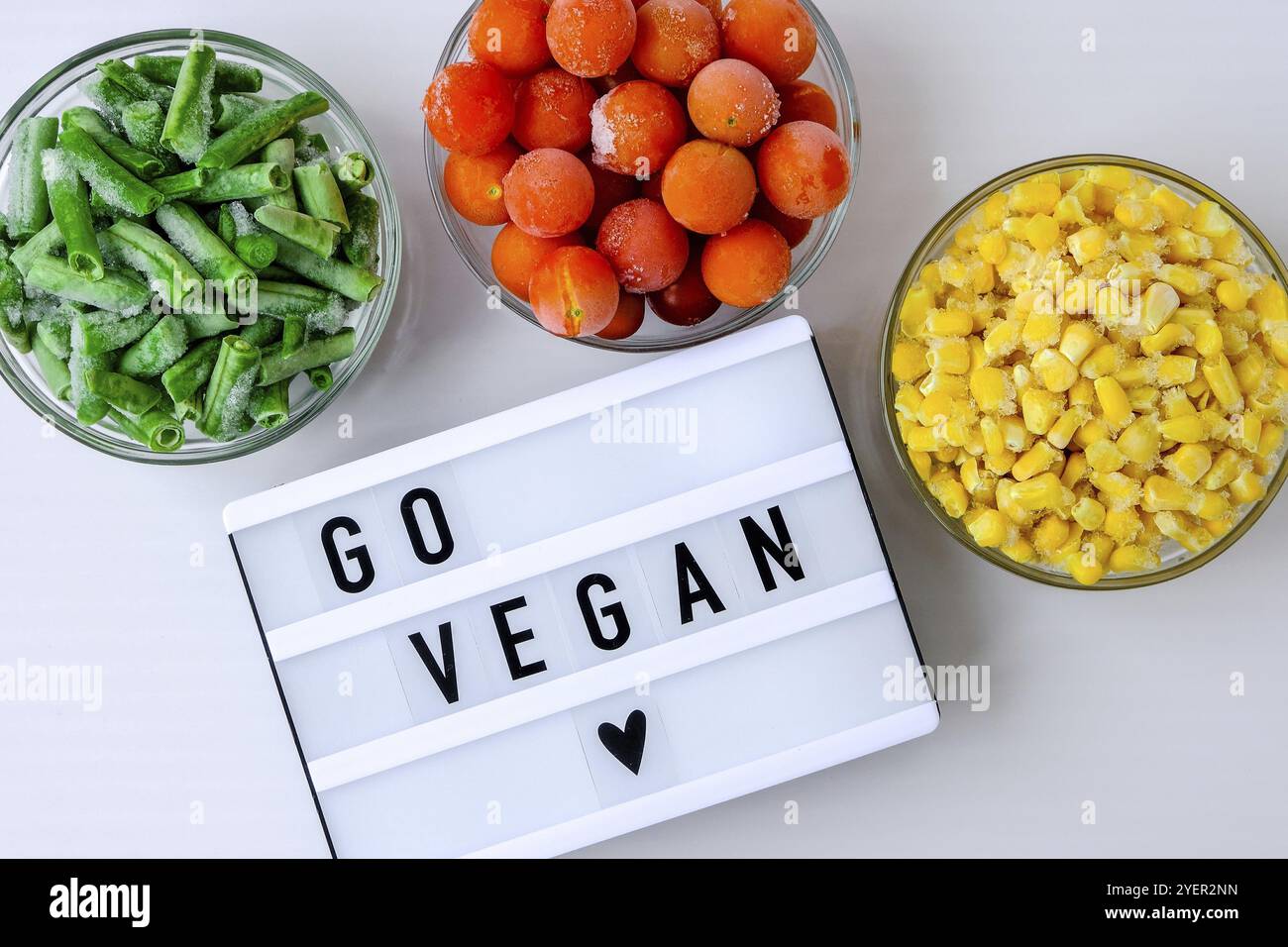 Lightbox with text GO VEGAN Three Bowls of frozen vegetables food of ...