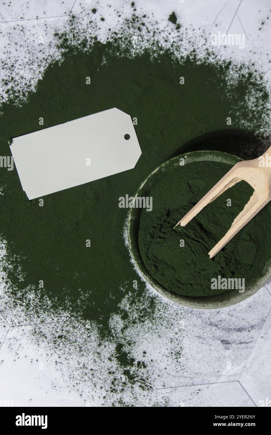 Blue-green algae Chlorella and spirulina powder in bowl with empty ...