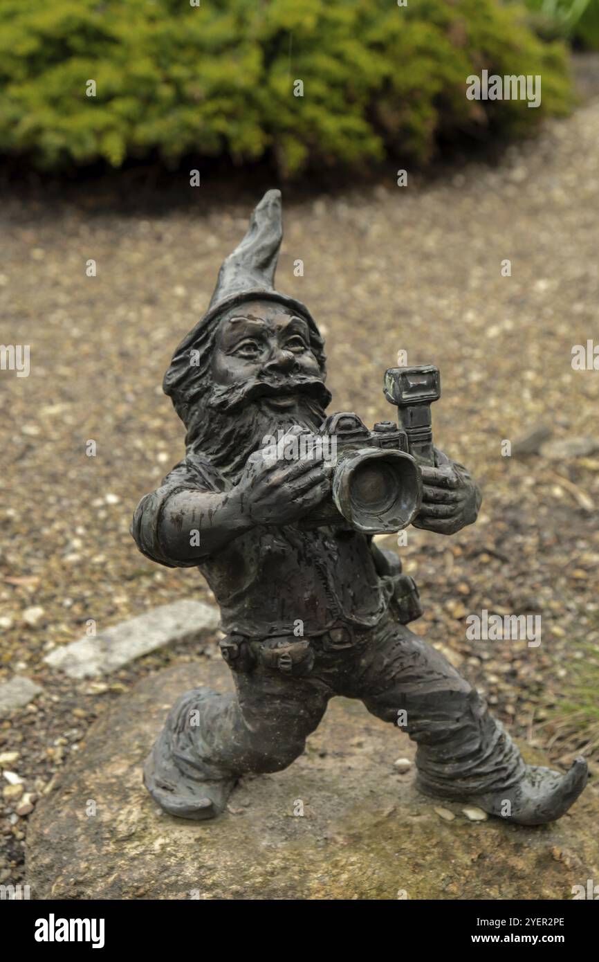 Dwarf with camera, photographer. Small bronze figures of gnomes on the ...