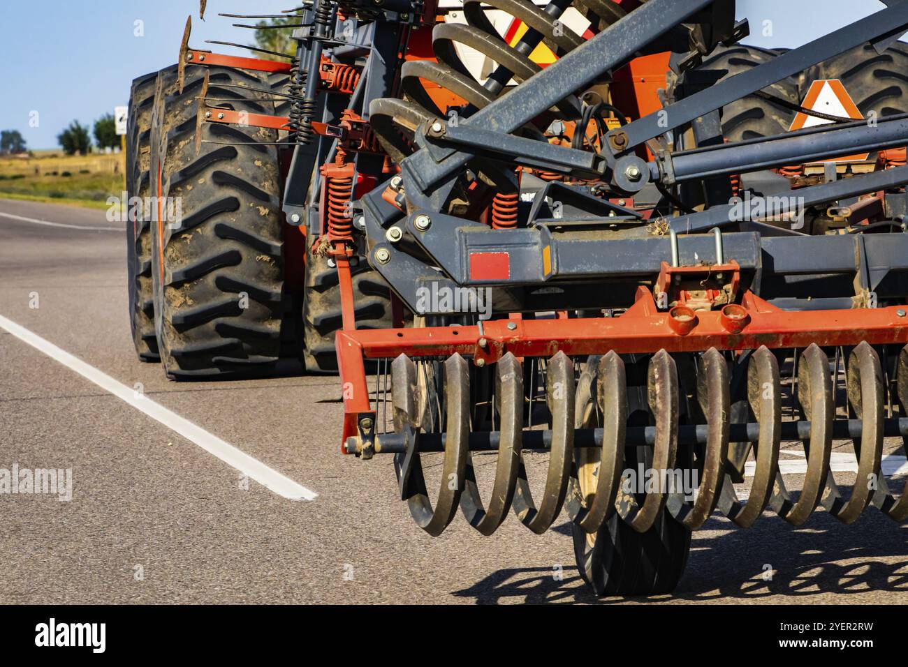 Closeup details of a tractor operated rotary tillage and plow device ...