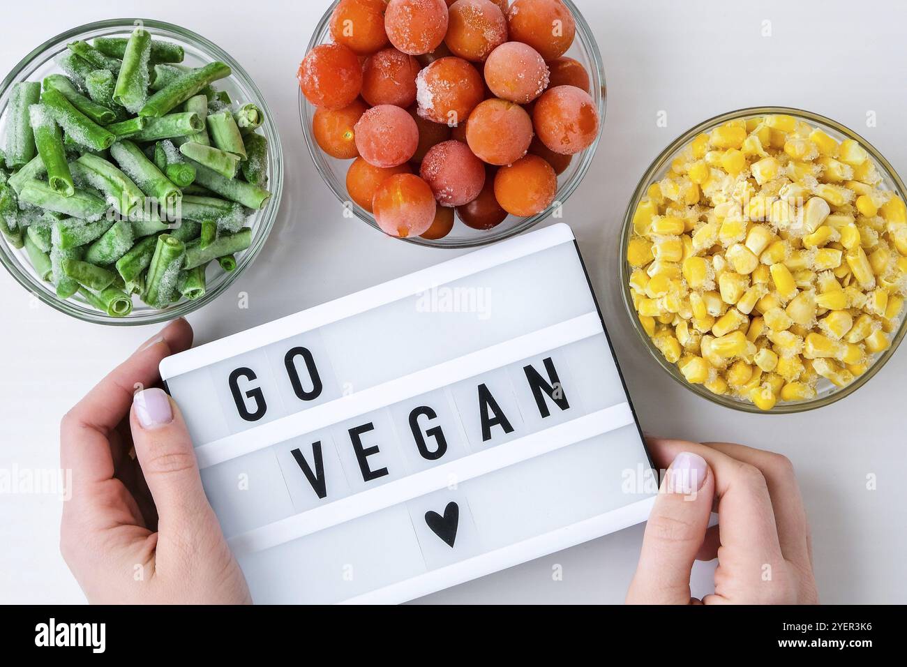Lightbox with text GO VEGAN Three Bowls of frozen vegetables food of ...