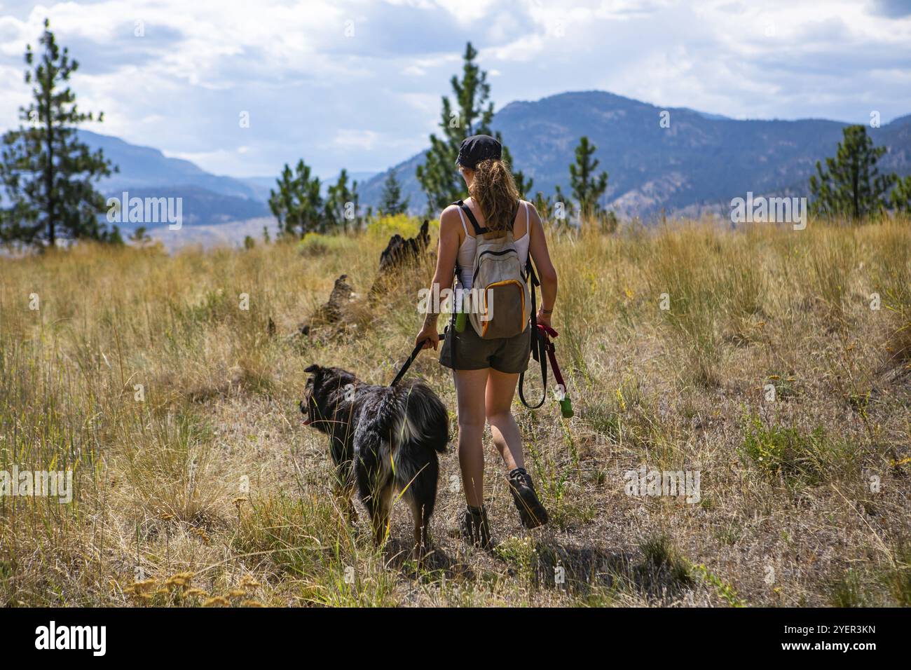 Girl in the woods on a dirt road walking and making jogging with her ...