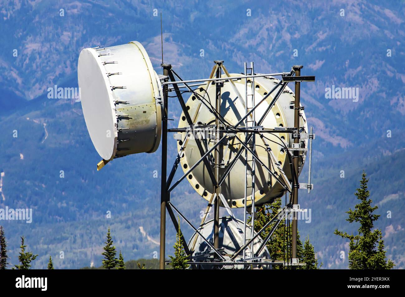 A close up and detailed shot on the top of a cellular network base station, two circular ...