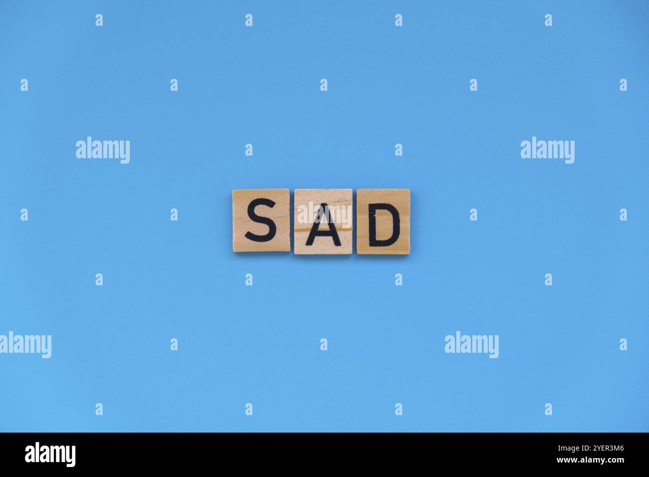Seasonal affective disorder, text of wooden blocks on blue bright ...
